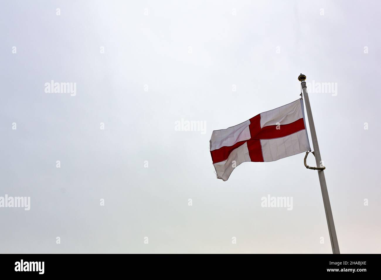 St George's cross flag isolated against a pure white sky Stock Photo ...