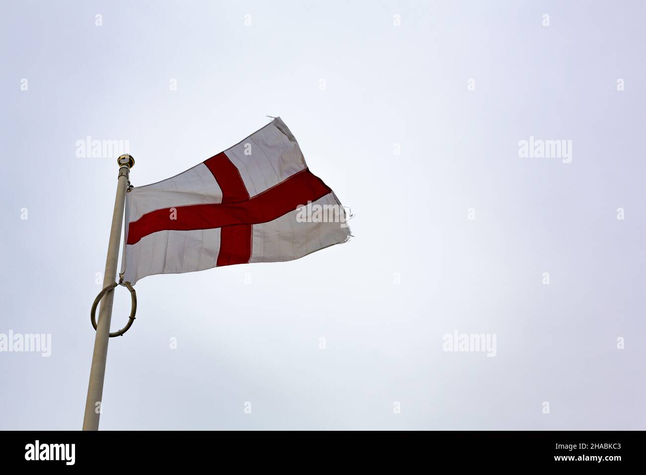 St George's cross flag isolated against a pure white sky Stock Photo ...