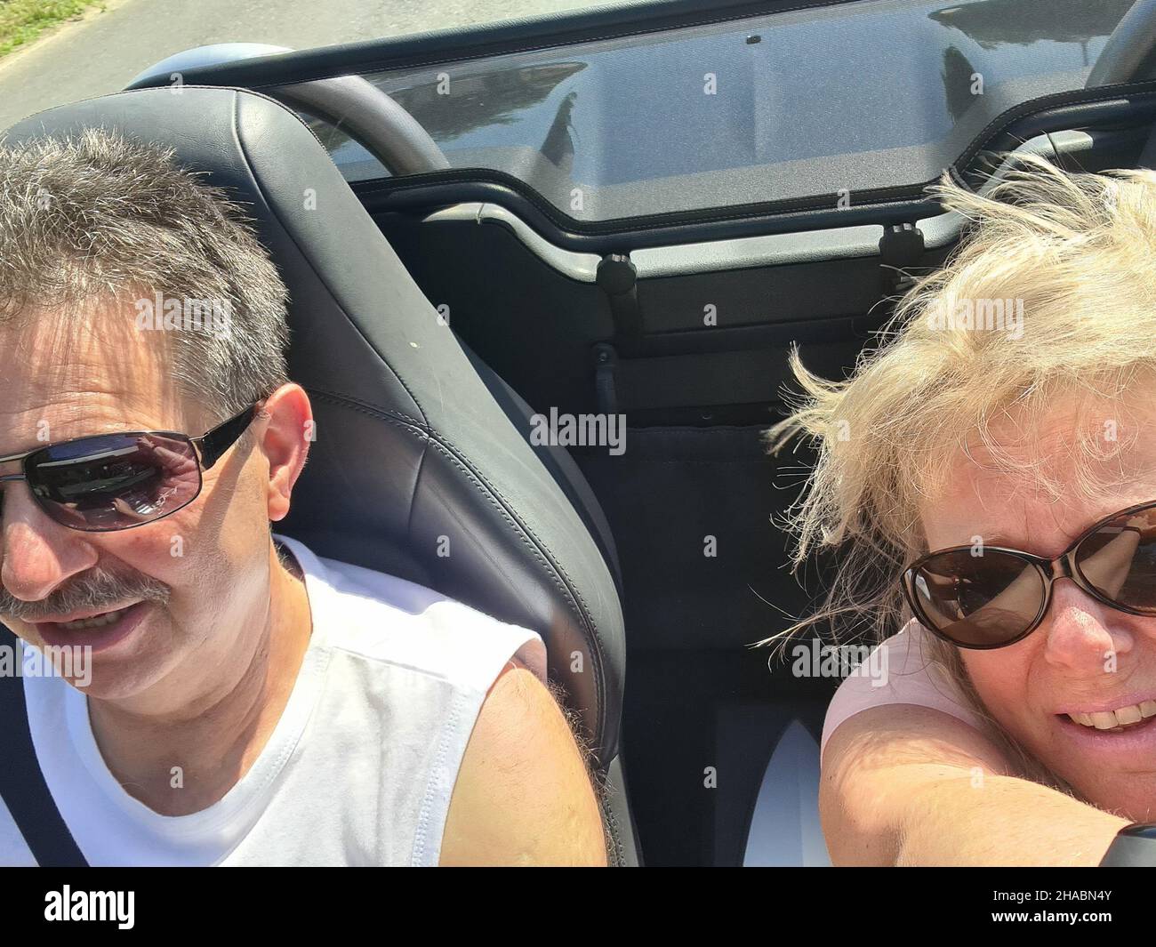 Two male friends driving open hi-res stock photography and images - Alamy