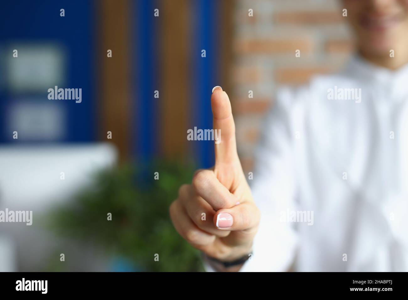 Young woman person show index finger or press virtual screen knob Stock ...