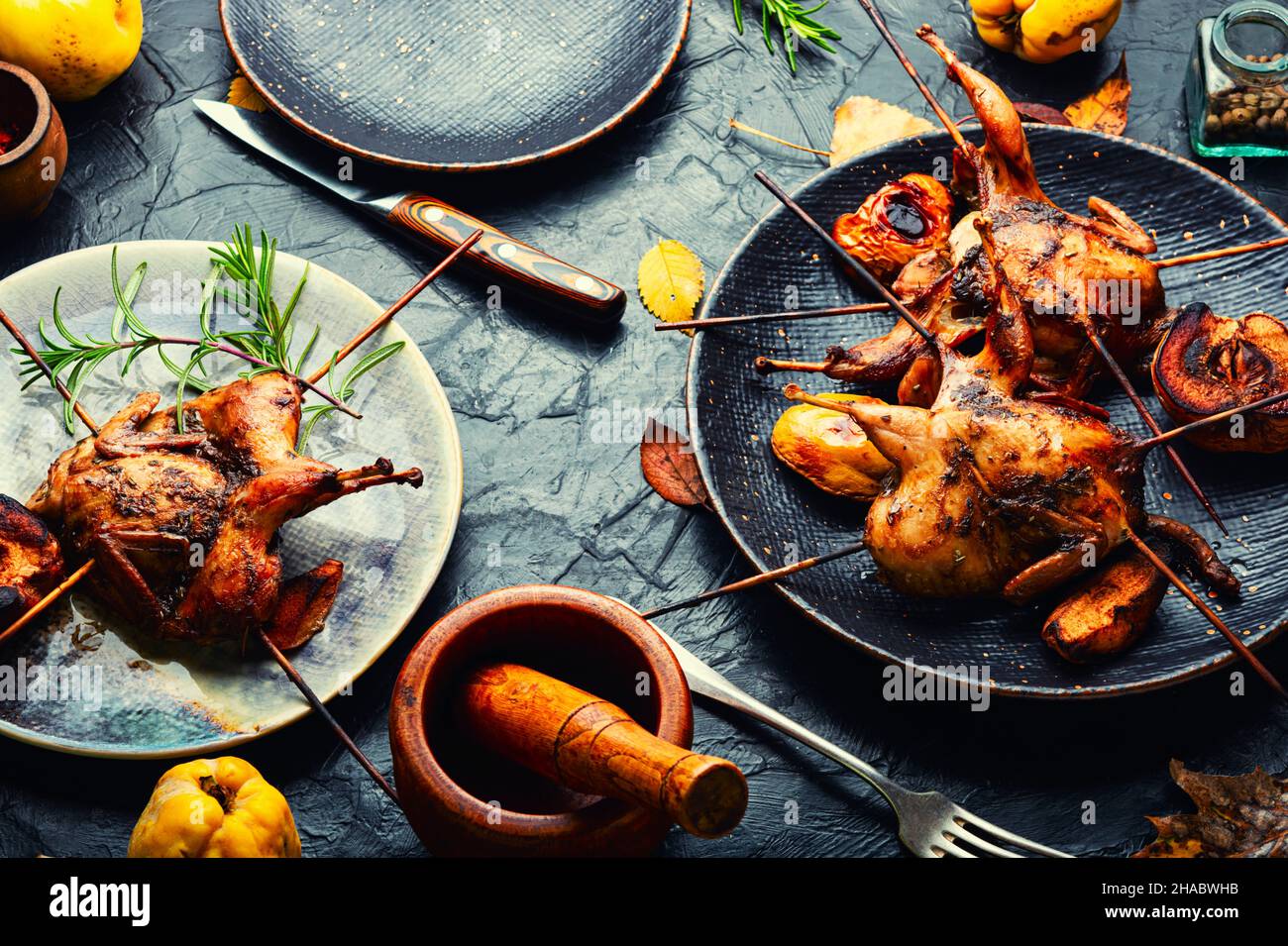 Tasty homemade quail grilled on skewers in fruit sauce Stock Photo - Alamy