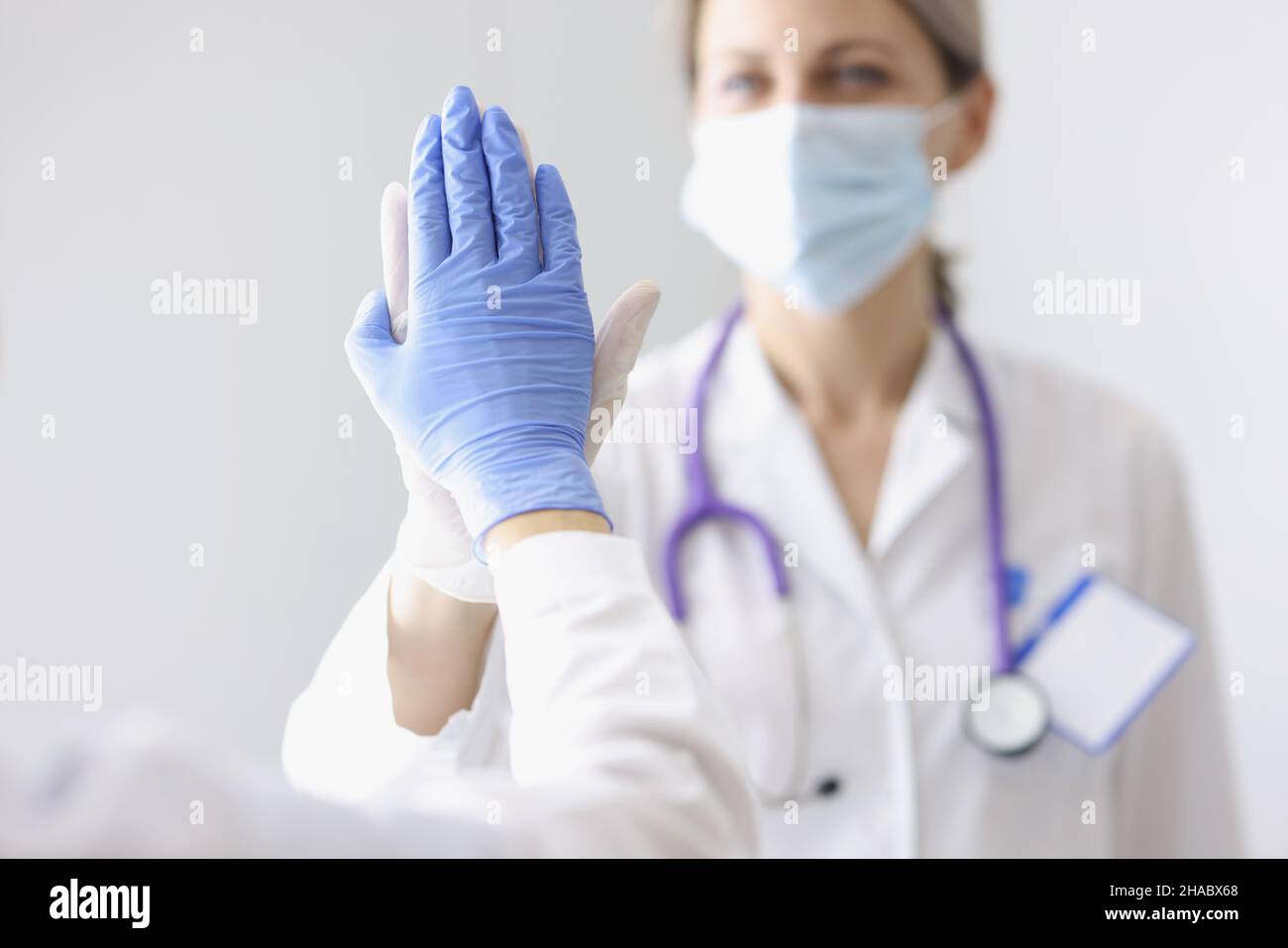 Medical coworkers give high five after successful surgery or diagnose ...