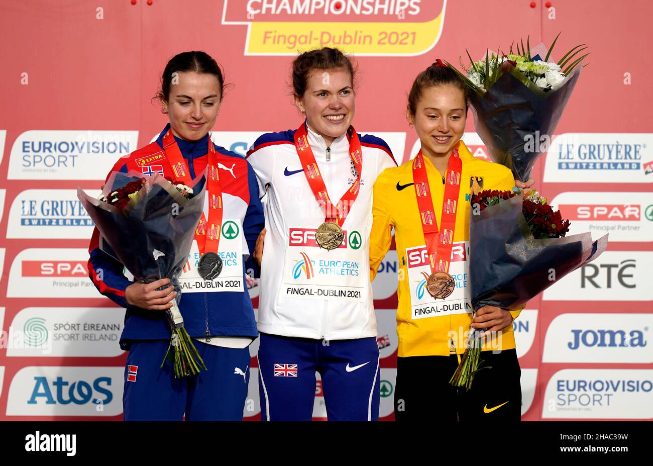 Great Britain's Megan Keith (centre) celebrates with their gold medal ...