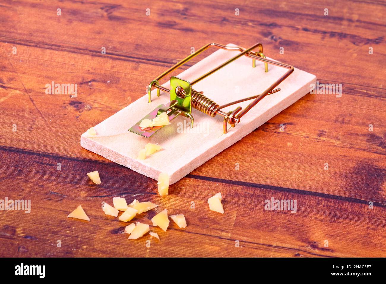 Conceptual image of a mousetrap where the mouse has taken the cheese ...