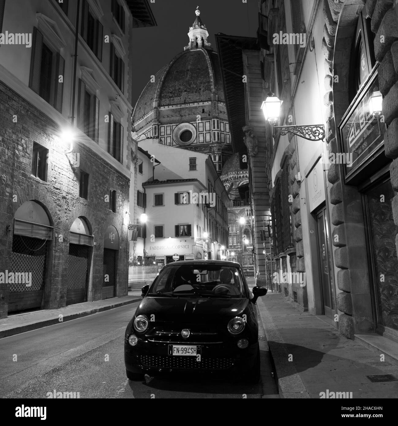 Street of Florence with Basilica Santa Maria del Fiore and Fiat symbol ...