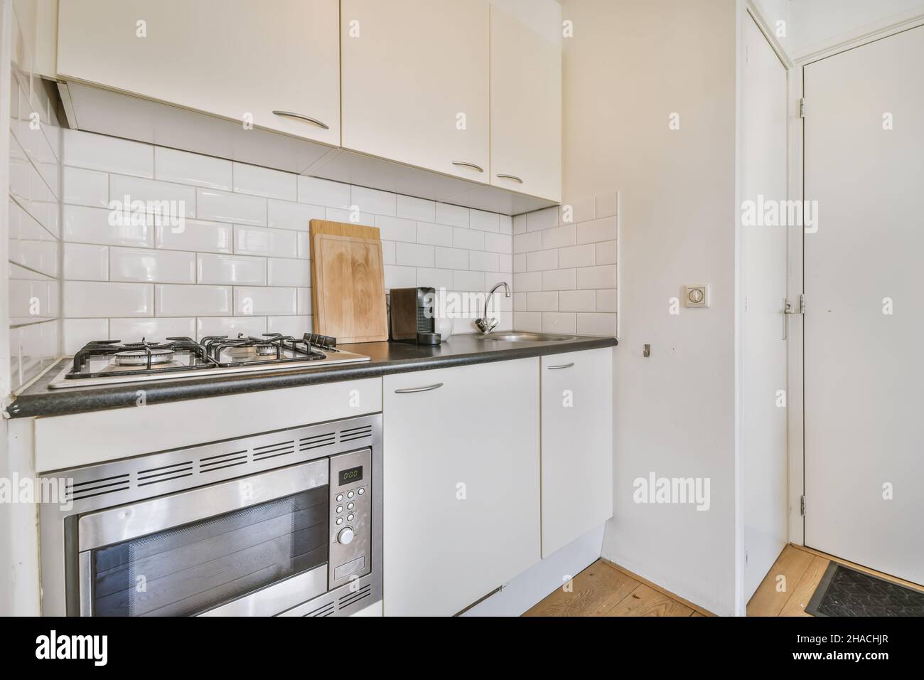 Delightful small kitchen area with microwave built into the kitchen ...