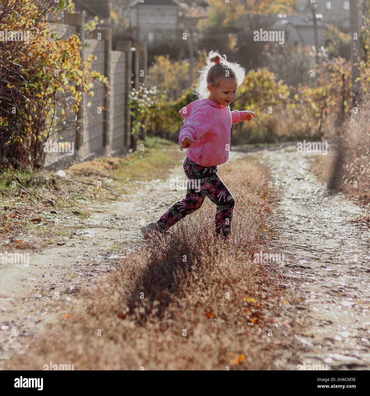 Baby 4 years old runs and jumps in the open air. Childhood moments ...