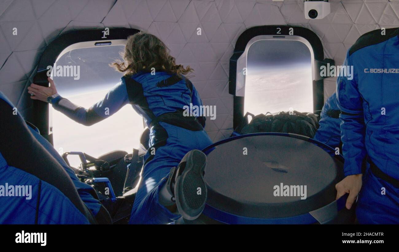 ABOARD NEW SHEPARD, EARTH - 13 October 2021 - Two of the Blue Origin ...