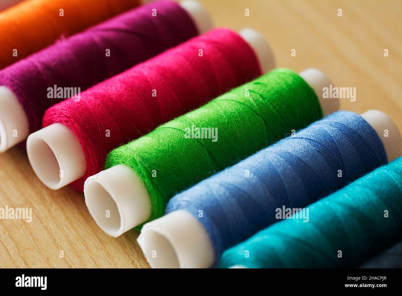 Many multicolor sewing threads, Yarn textile, Spool Stock Photo - Alamy