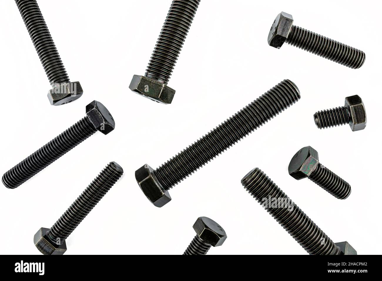 Background made of black screws with a hardness of 4.8, isolated on a ...