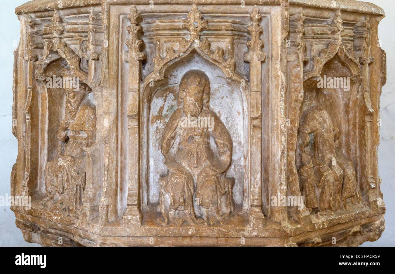 Fourteenth century baptismal font carved figures of an ecclesiastical ...