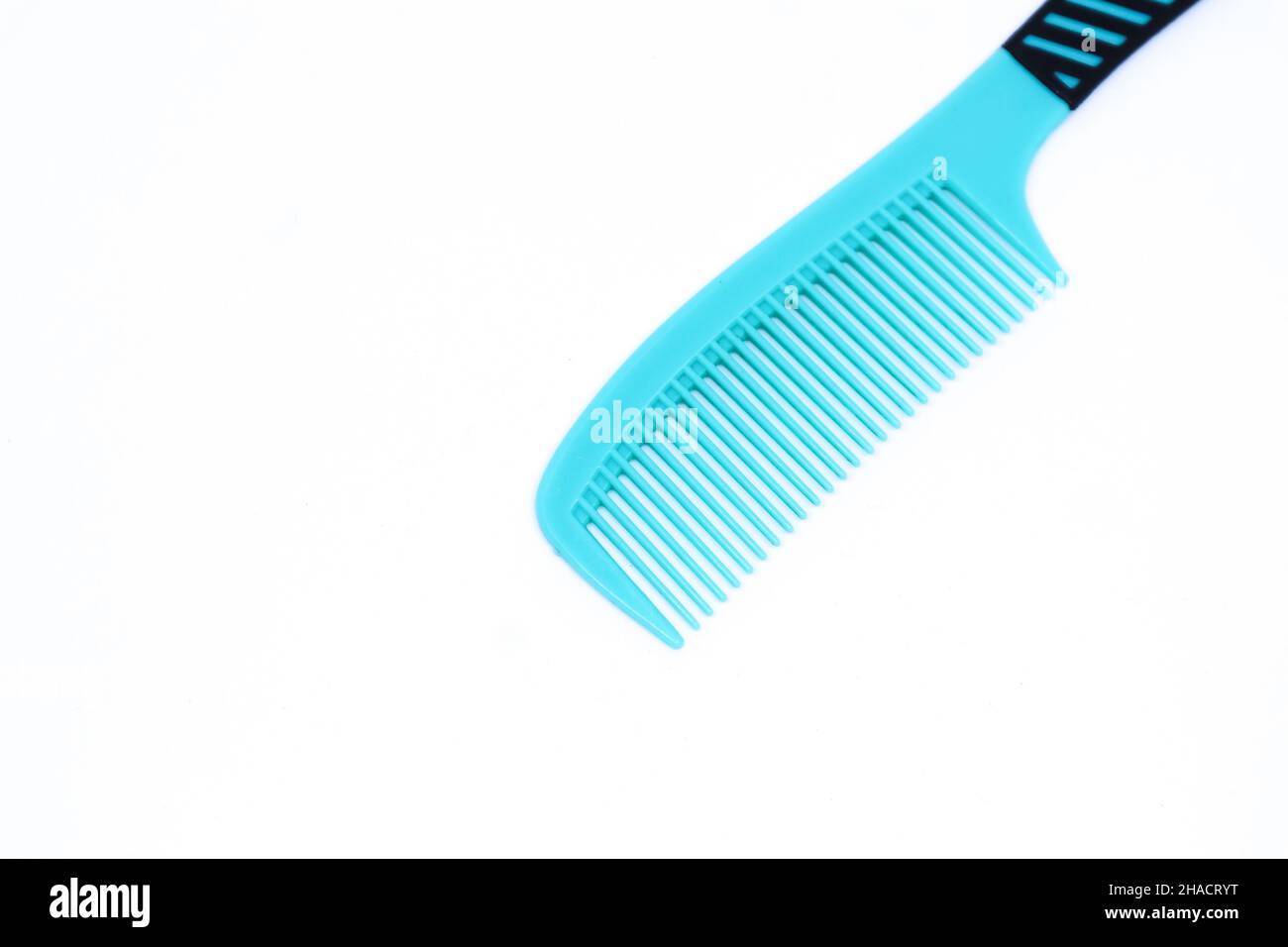 An Aqua Blue Comb in The Corner of Minimalist White Background with ...
