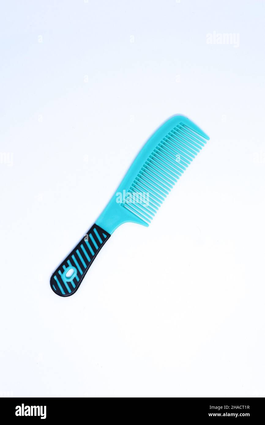 An Aqua Blue Comb in The Minimalist White Background with Flat Lay Shot ...