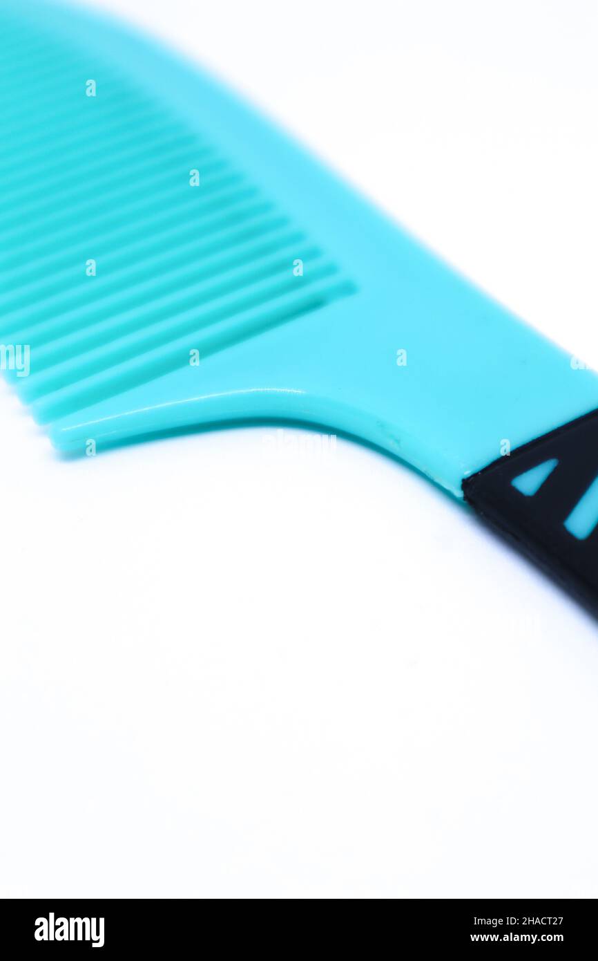 Detail of An Aqua Blue Comb in The White Background with Oblique Top ...