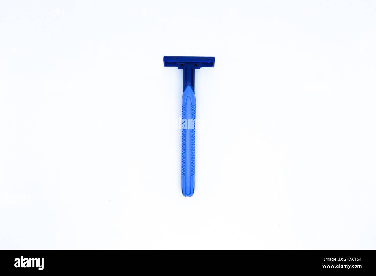 Flat Lay Shot of A Blue Razor Top in The White Background, Landscape ...