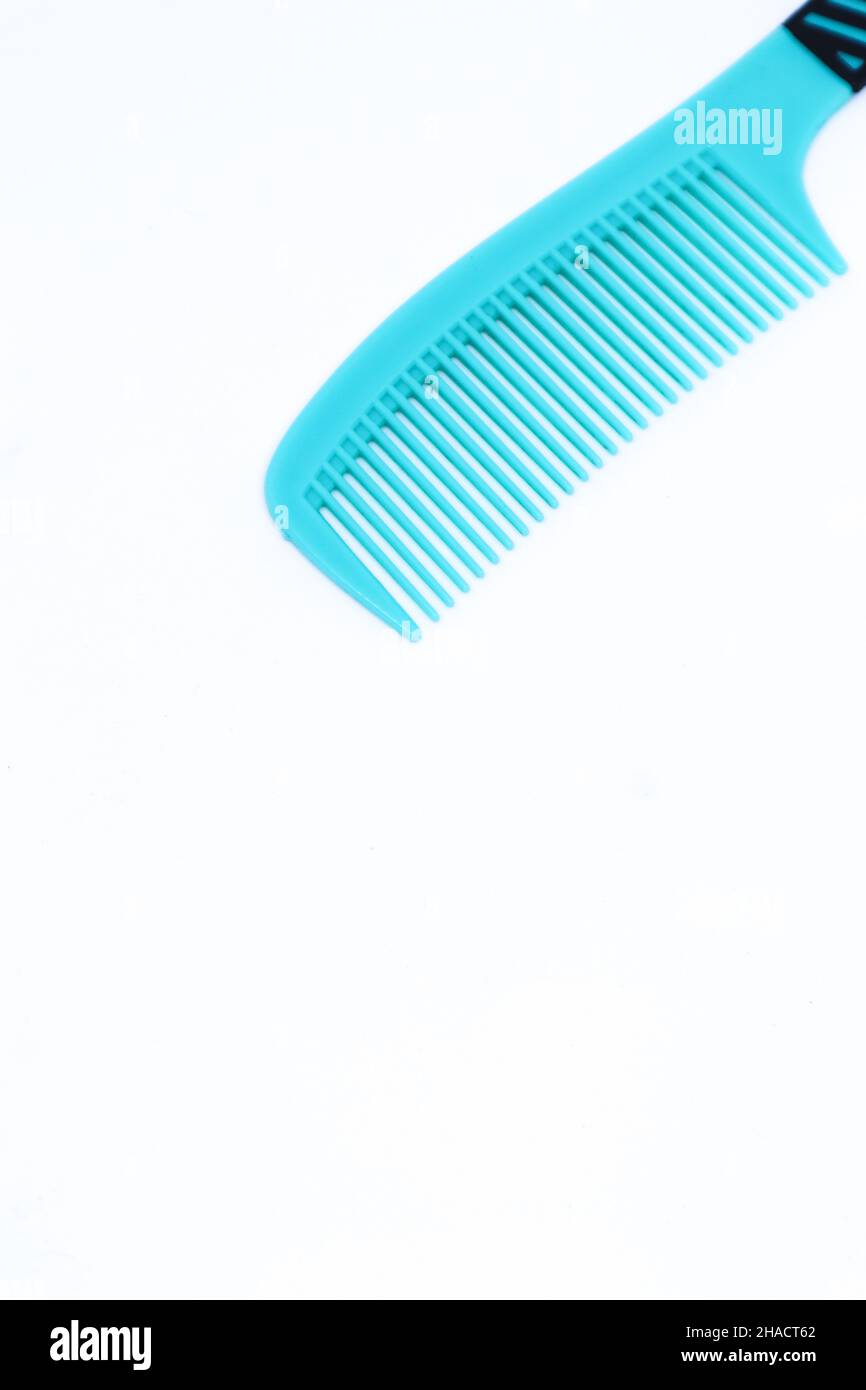 Flat Lay Shot of An Aqua Blue Comb in The Corner of Minimalist White ...