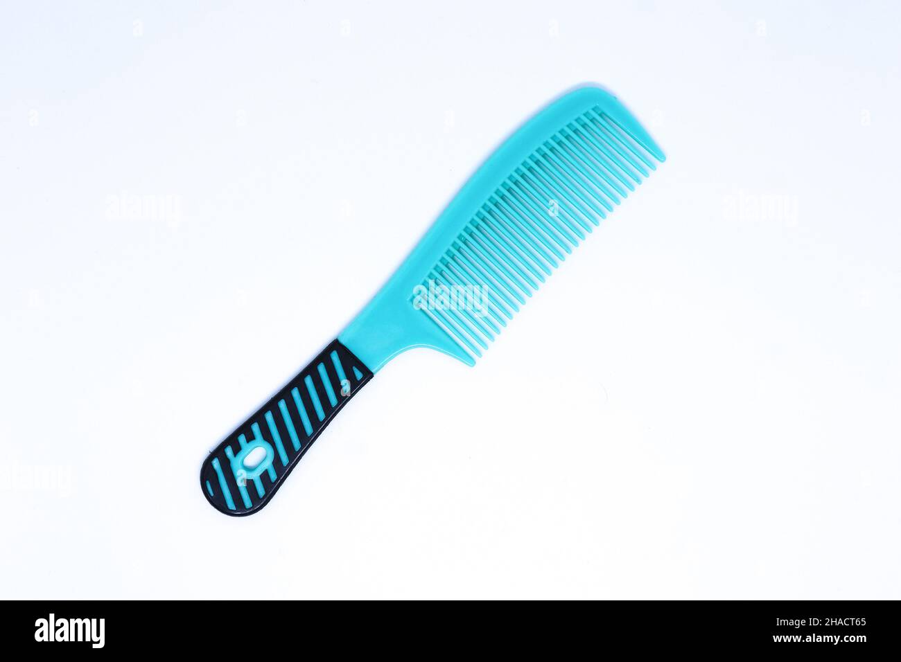 Flat Lay Shot of An Aqua Blue Comb in The White Background, Landscape ...