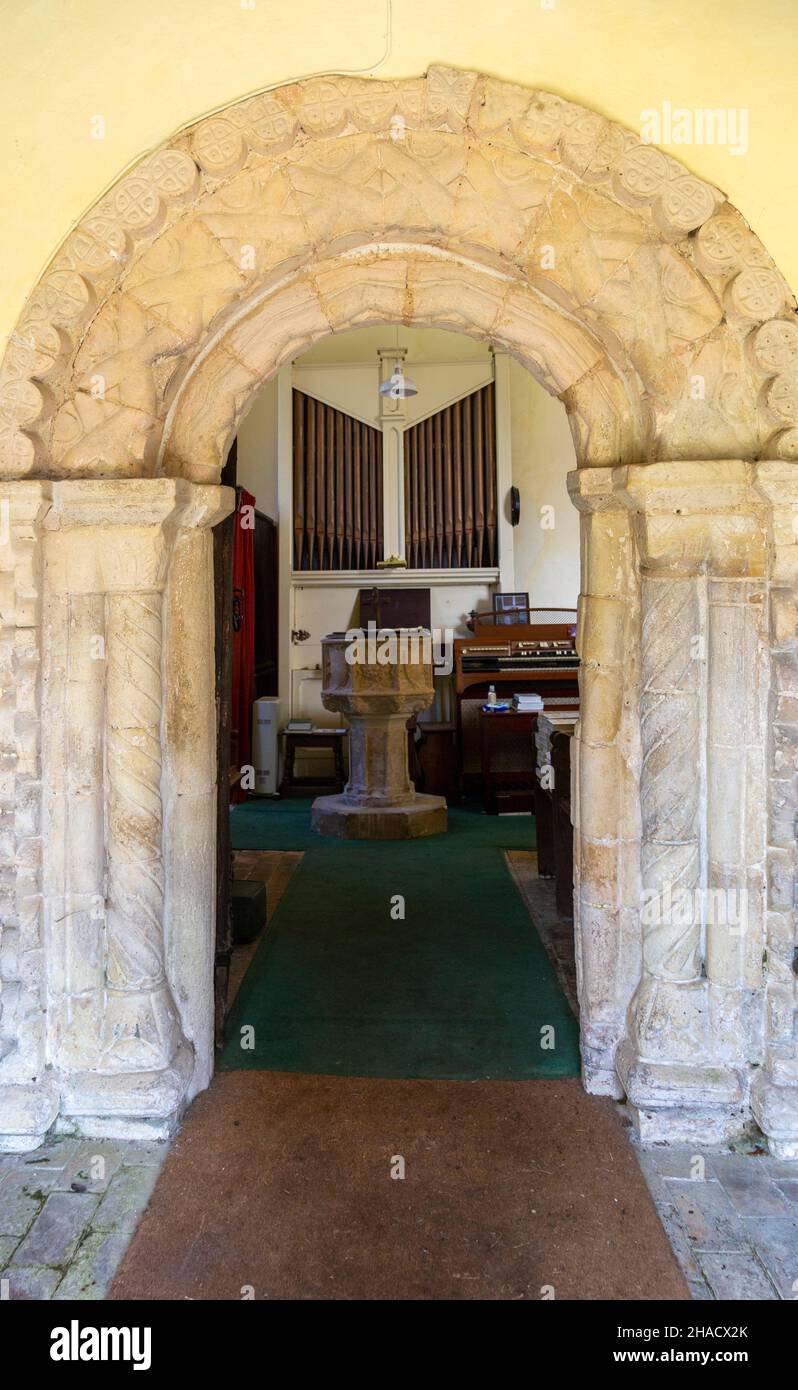 Norman arched doorway entrance with chevron stone mouldings, Redisham ...