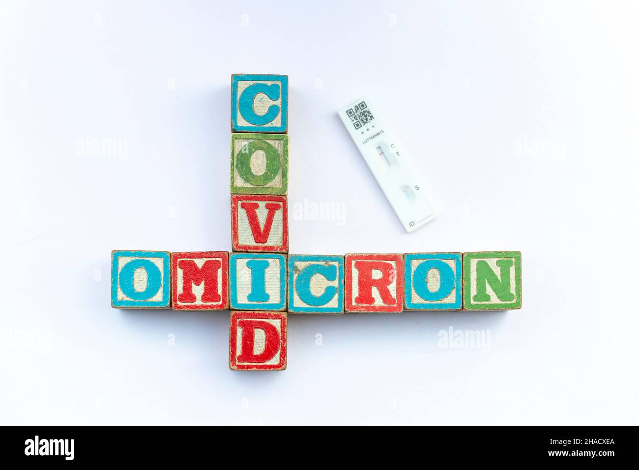 covid and omicron spelled out in old children's letters building blocks ...