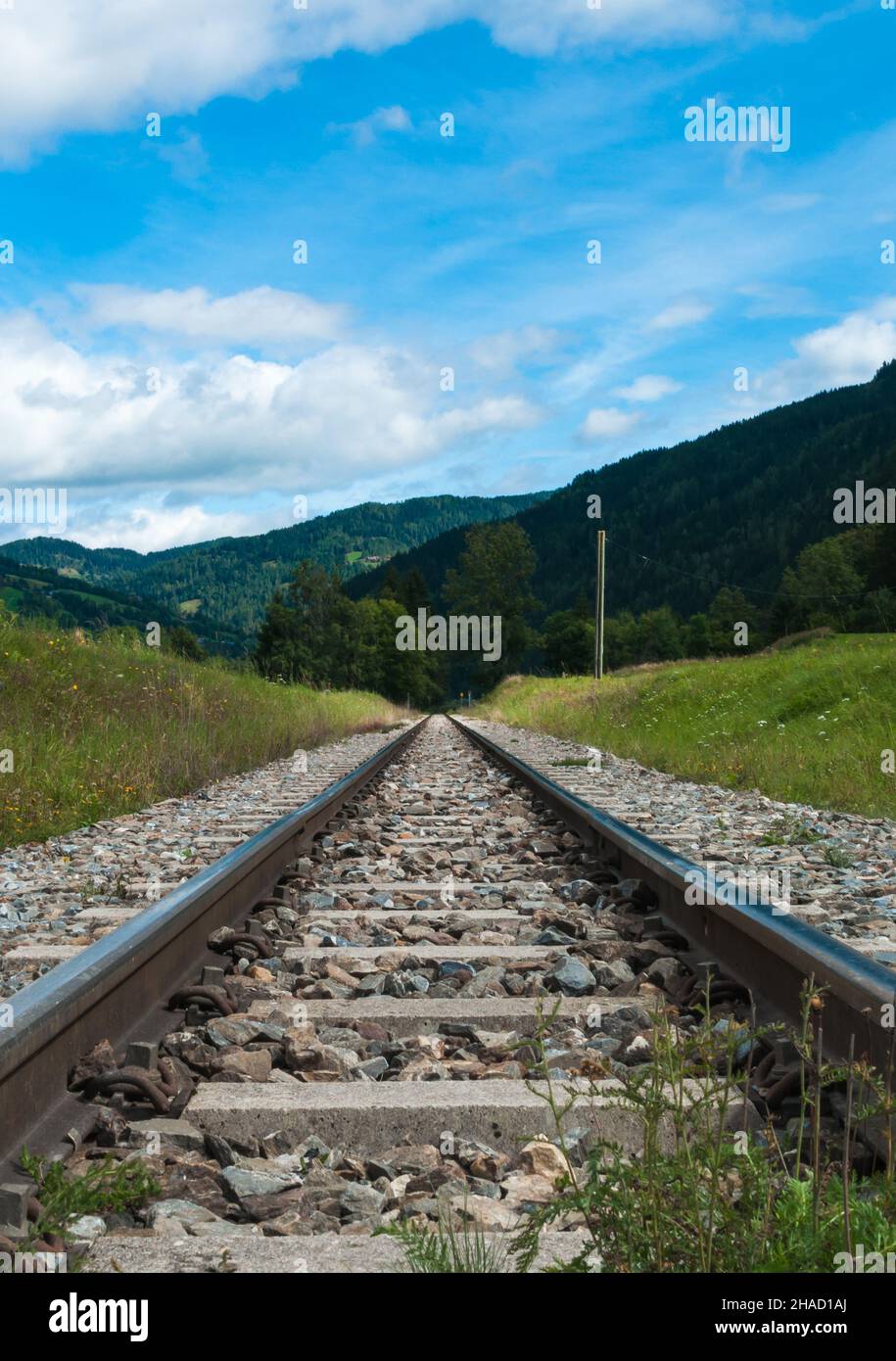 The way to somewhere. Perspective view of train tracks that appear to ...