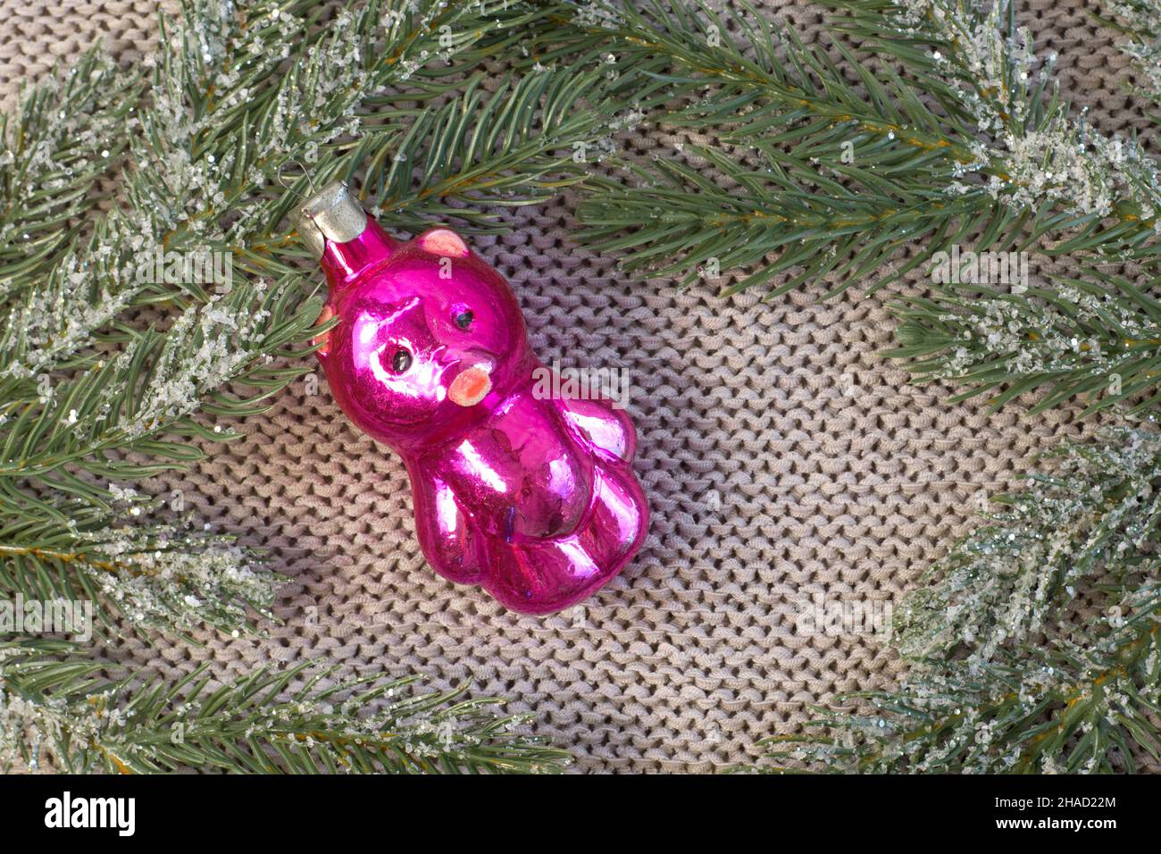 Christmas decoration glass pink bear in vintage style at light textured ...