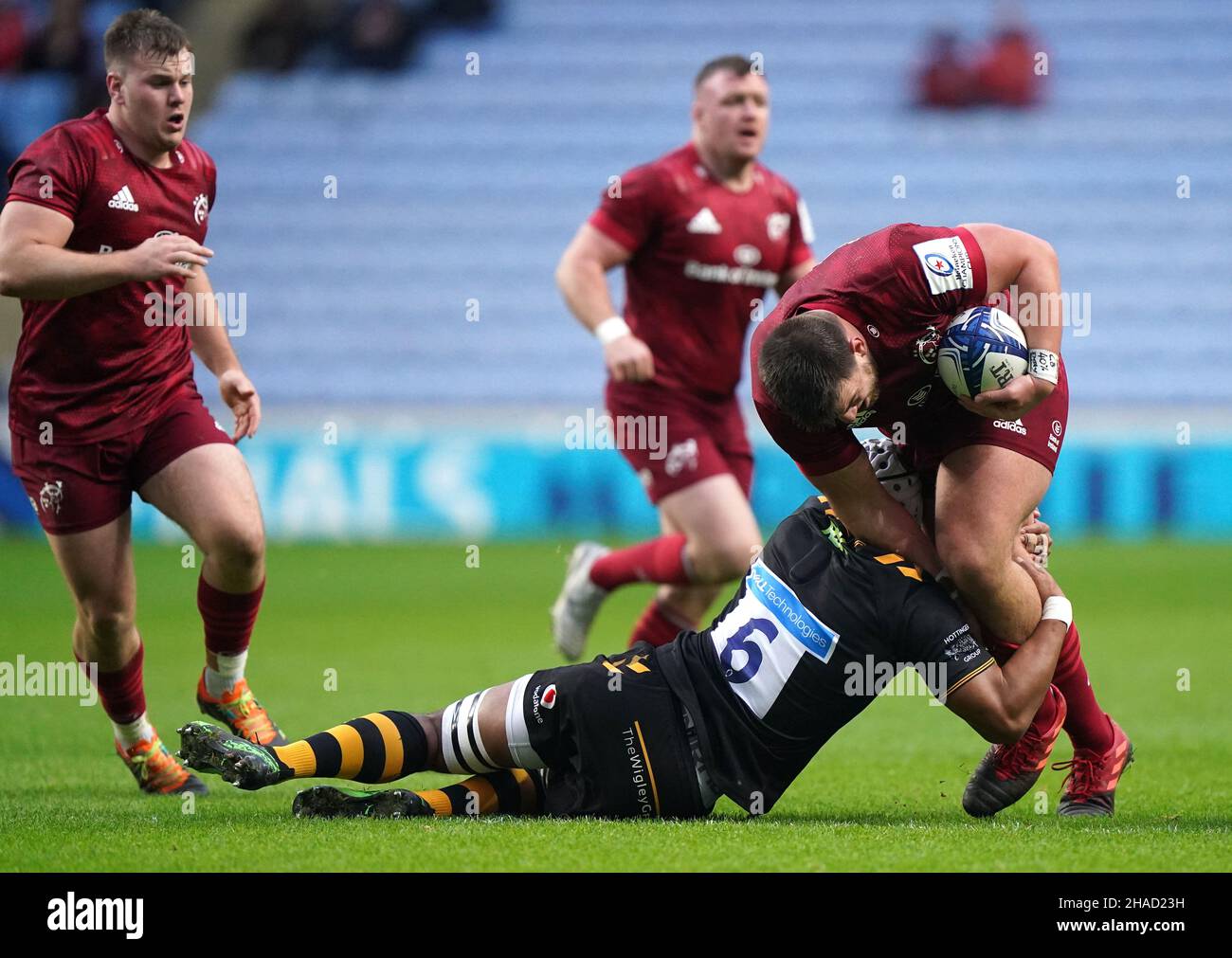 Munster's James French (right) tackled by Wasps' Nizaam Carr during the ...