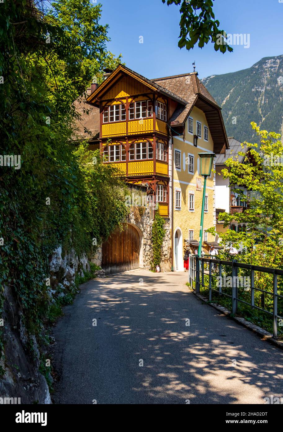 Road leading the way to a beautiful, bright, yellow building in ...