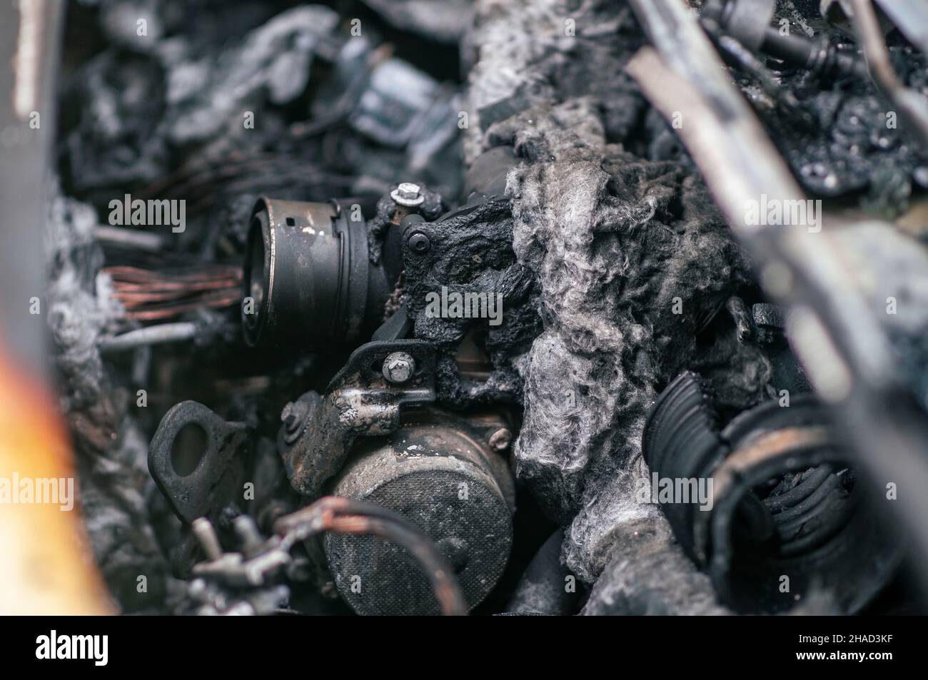 Burned car. abstract close up of the melted parts of a fire damaged ...