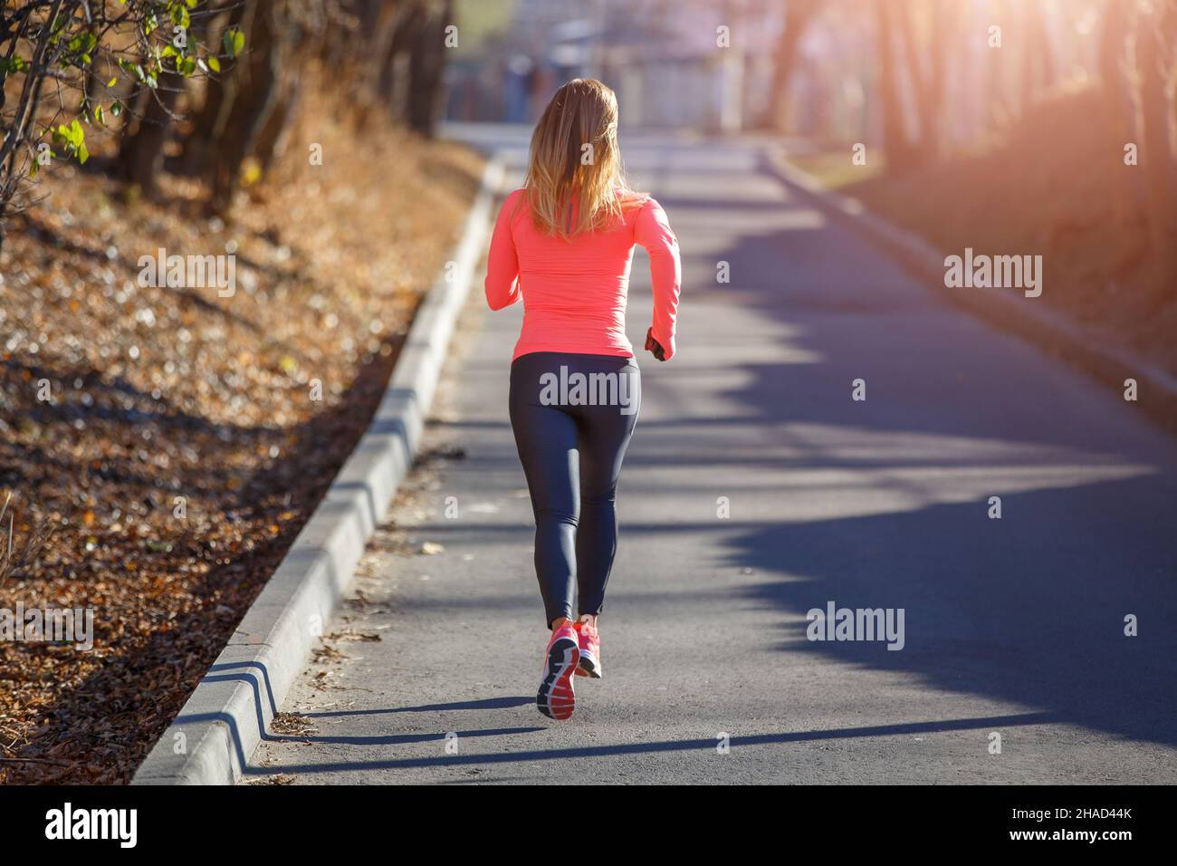 Back view running woman in hi-res stock photography and images - Alamy