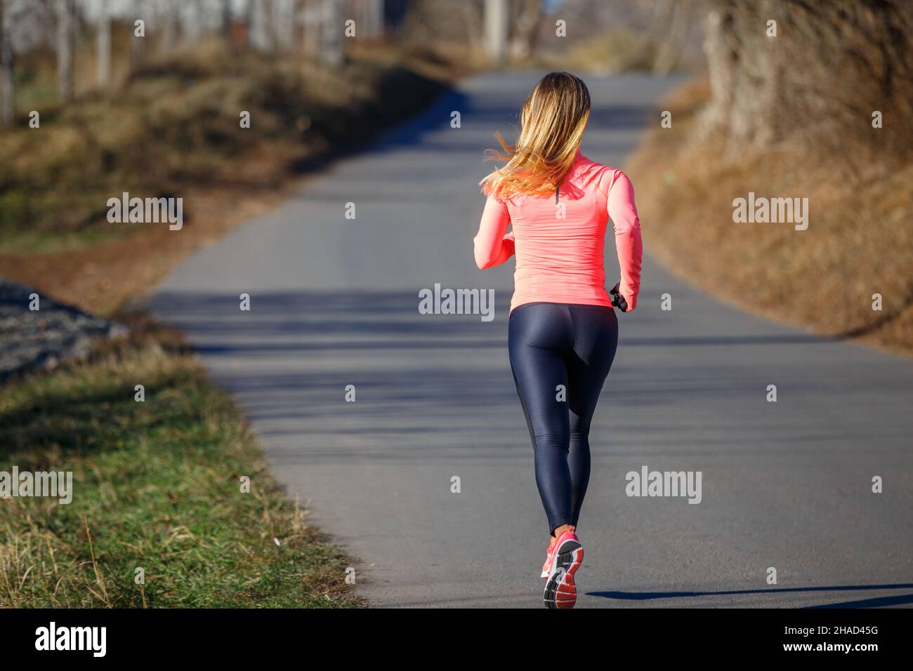 Back view running woman in hi-res stock photography and images - Alamy