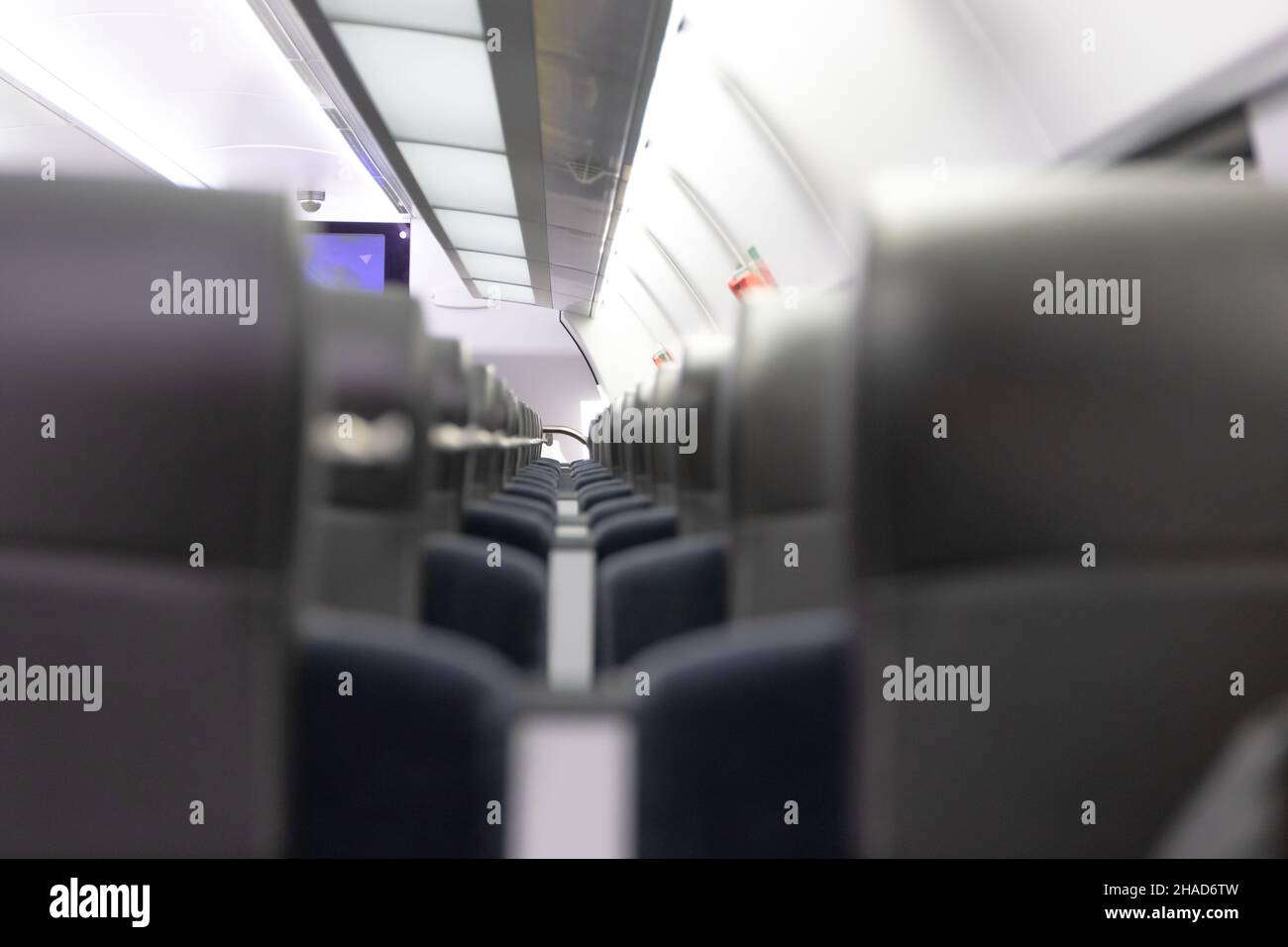 An empty cabin of the aeroexpress train without passengers. Soft seats ...