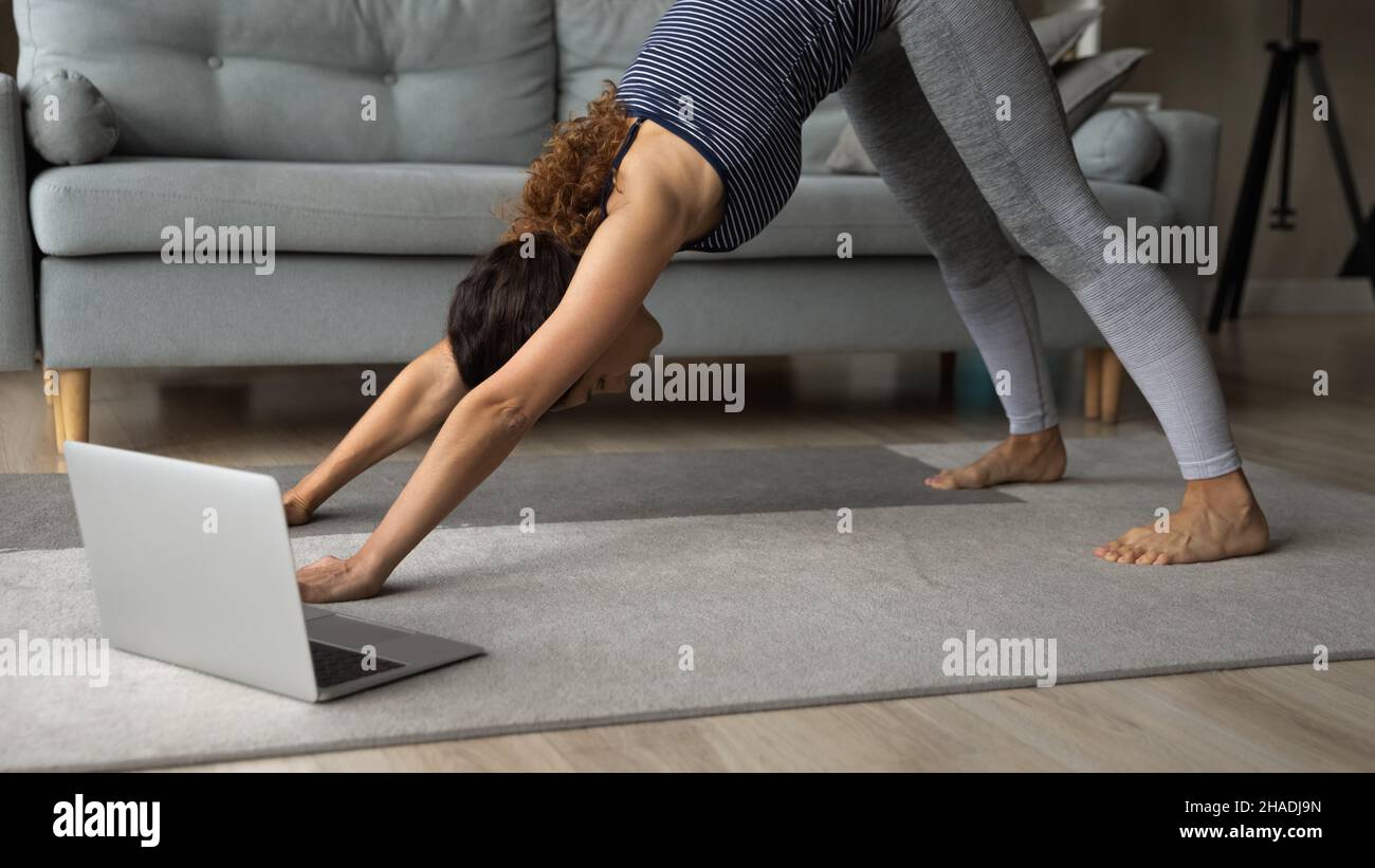 Healthy Latin woman do morning exercise with online training app Stock ...