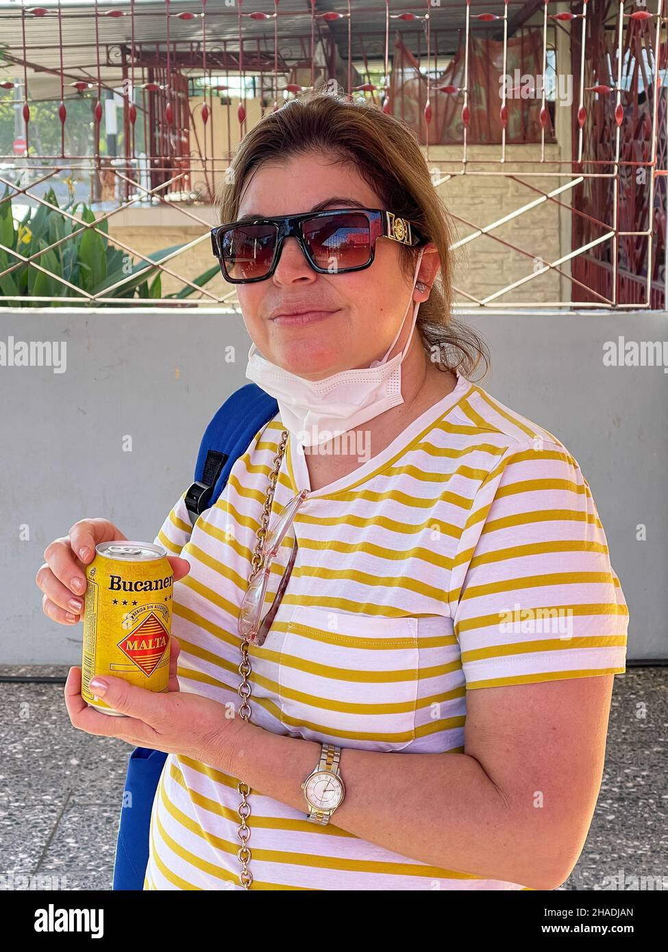 Woman with Bucanero Malta Drink, Cuba Stock Photo - Alamy