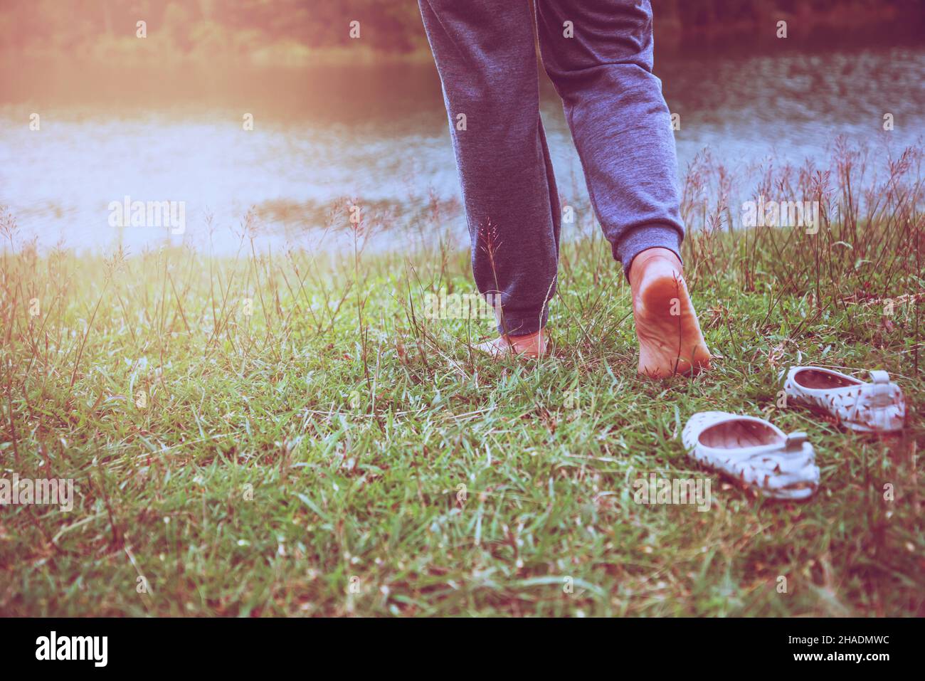 Asian women relax in the holiday. Walking foot on the meadow Stock ...