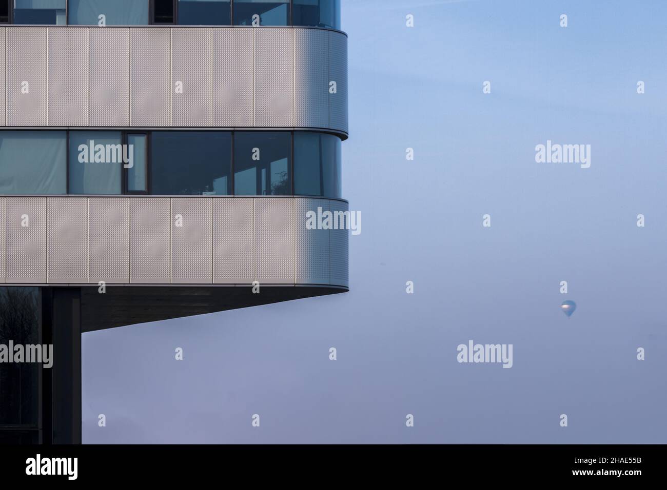A part of a high rise triangular building in the blue sky background ...