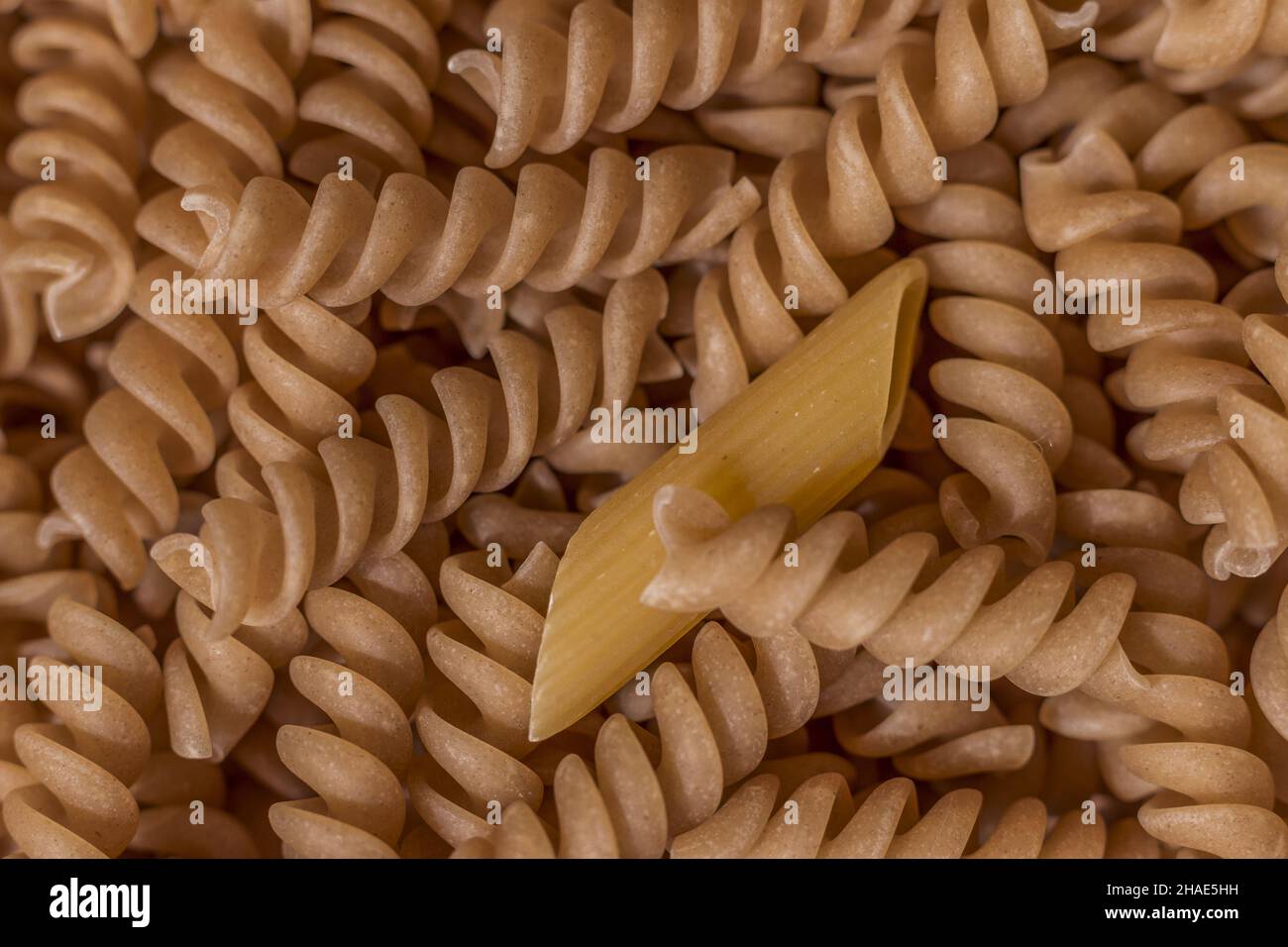 A texture of raw traditional fusilli and pasta Stock Photo - Alamy
