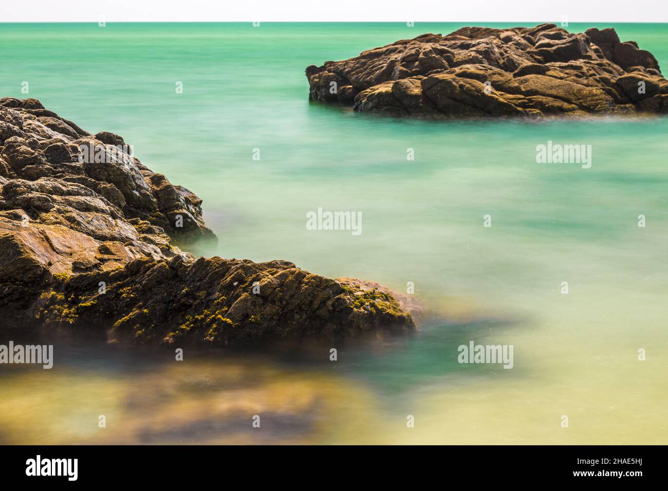 Big rocks in the iridescent seawater, Greece Stock Photo - Alamy