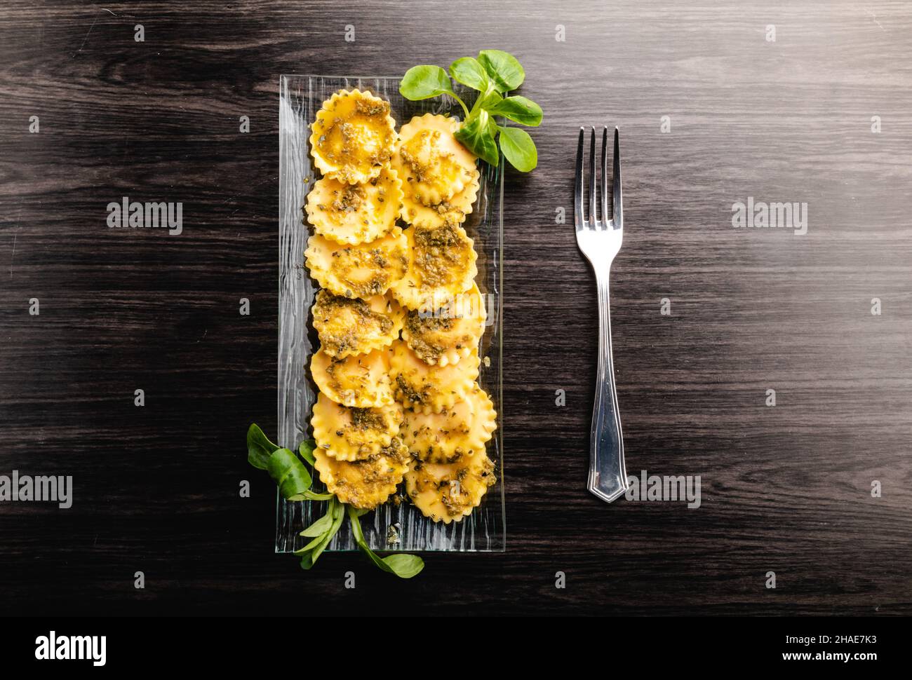 Italian stuffed pasta ravioli with pesto sauce Stock Photo - Alamy