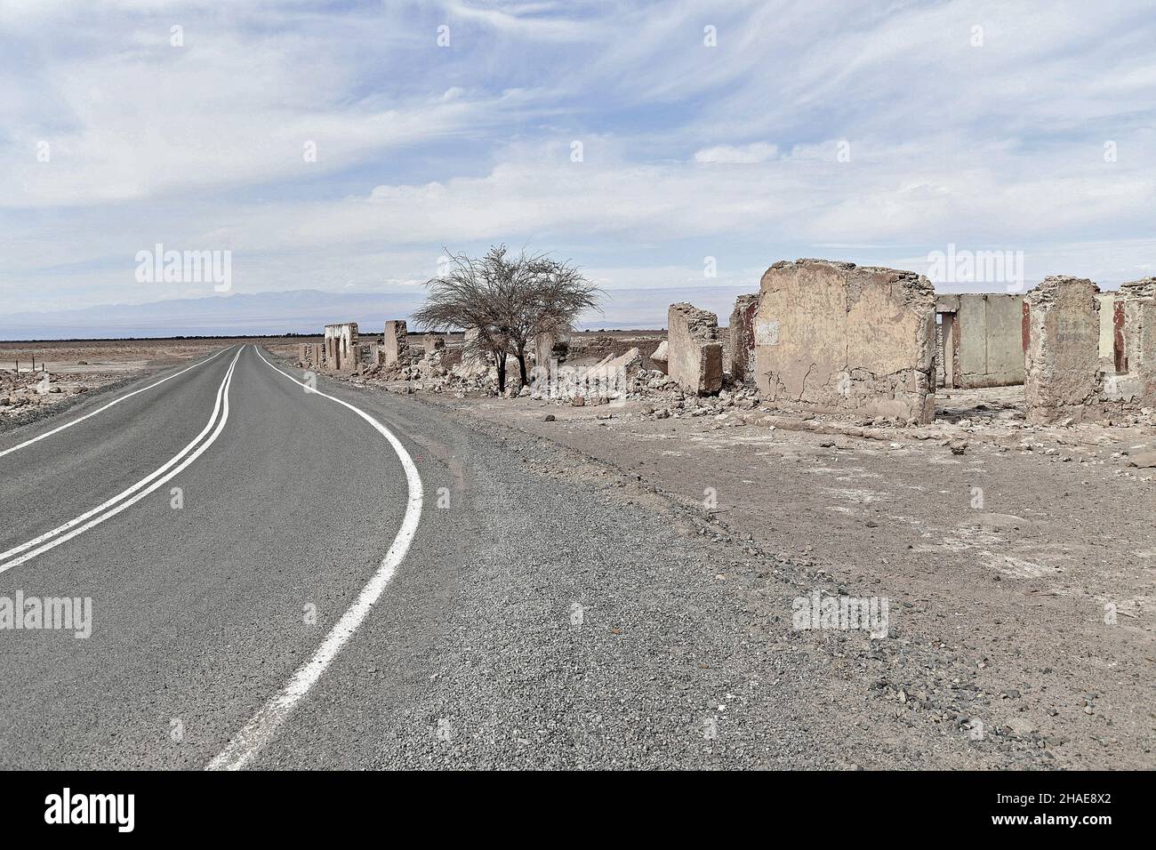 The cloudy sky over the asphalt road in the northern area of Chile at ...