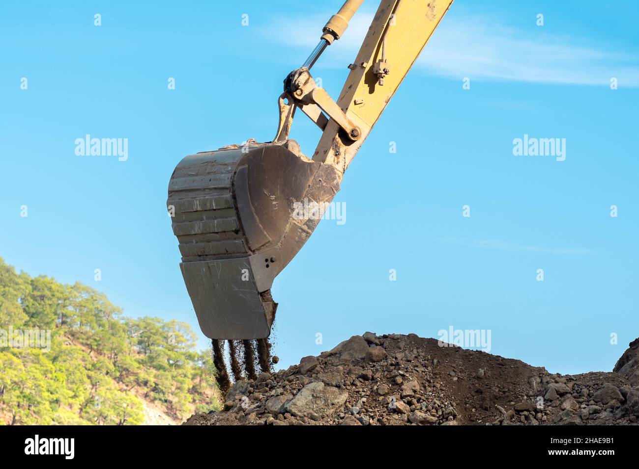 bucket of excavator carries out construction work close-up Stock Photo ...