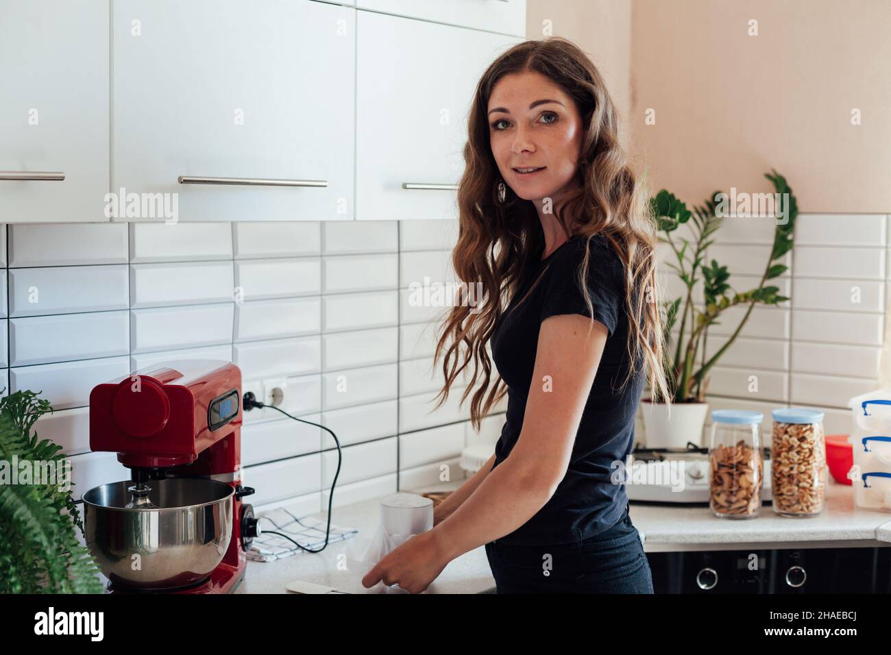 woman housewife cooks sweet cake desserts in the kitchen Stock Photo ...