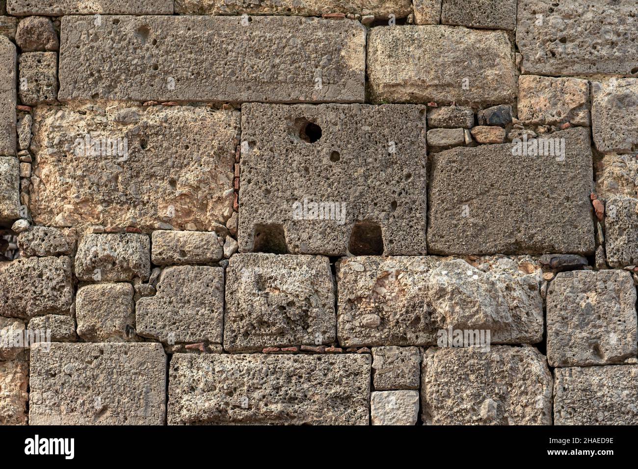 background - antique stone wall made of huge blocks of various sizes ...