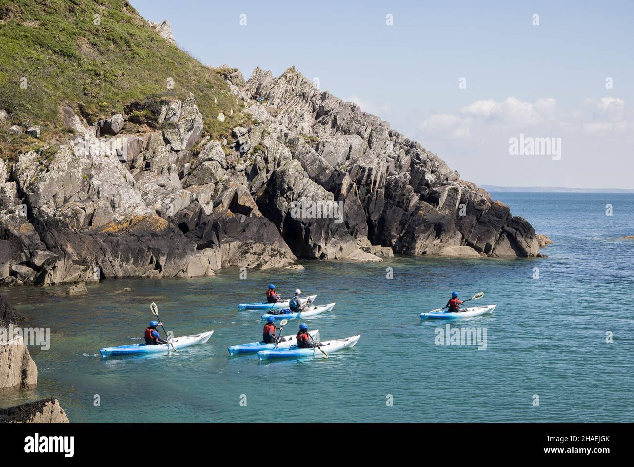 Kayaking around the coast at Porthclais, Pembrokeshire, Wales, UK Stock ...