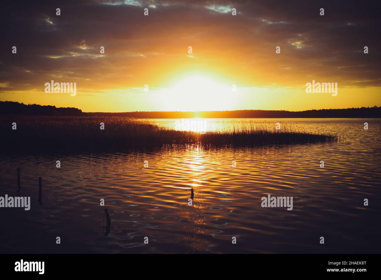 Yellow sunset on the lake. Blurred natural background, Sunset sky over ...