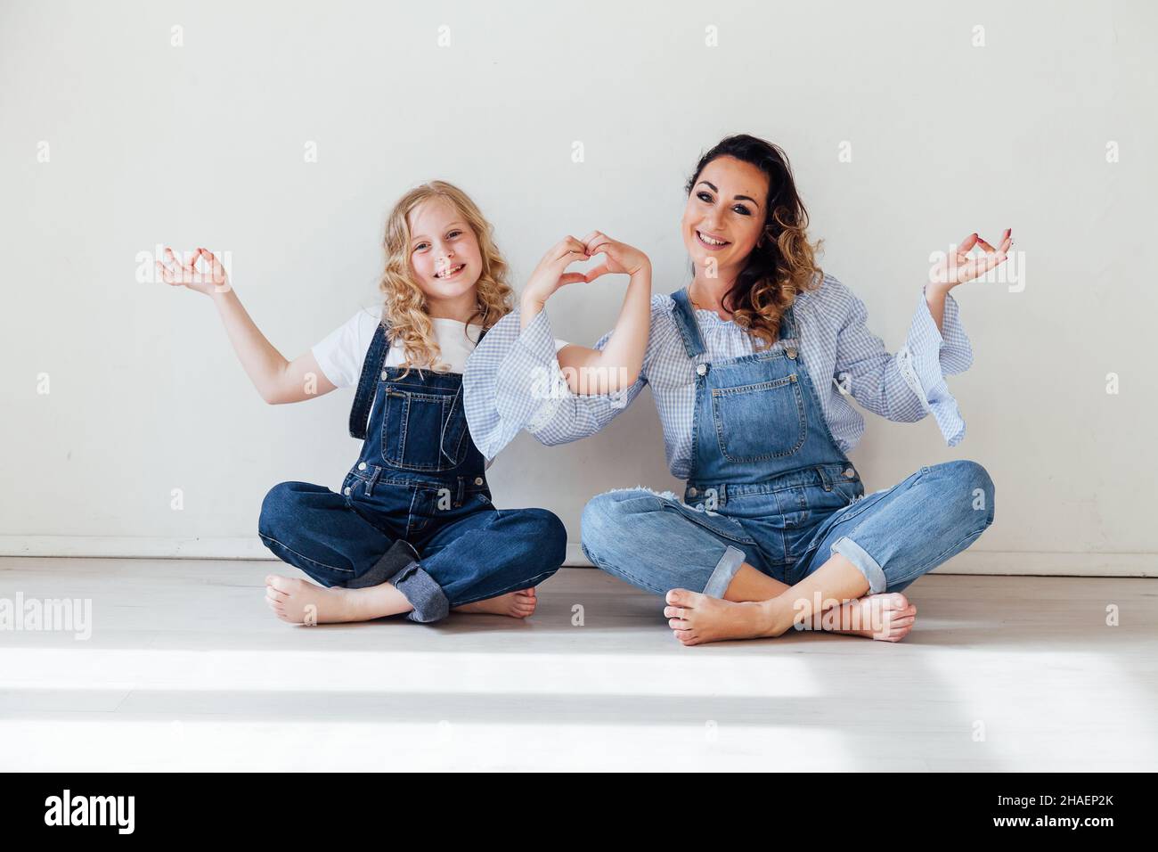 mother and daughter show their heart with their hands Stock Photo - Alamy