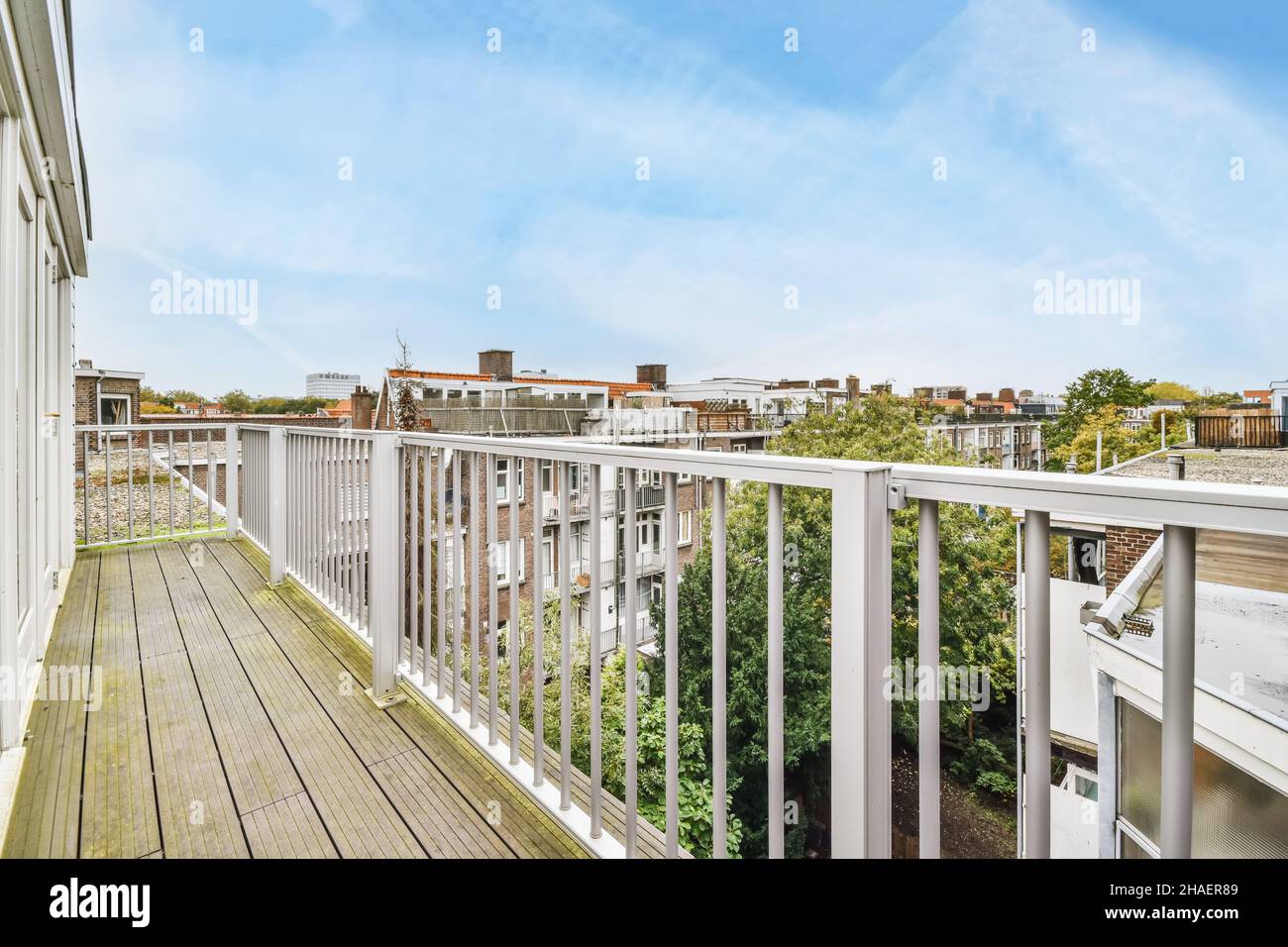 Narrow long balcony with iron railings and stunning views Stock Photo ...