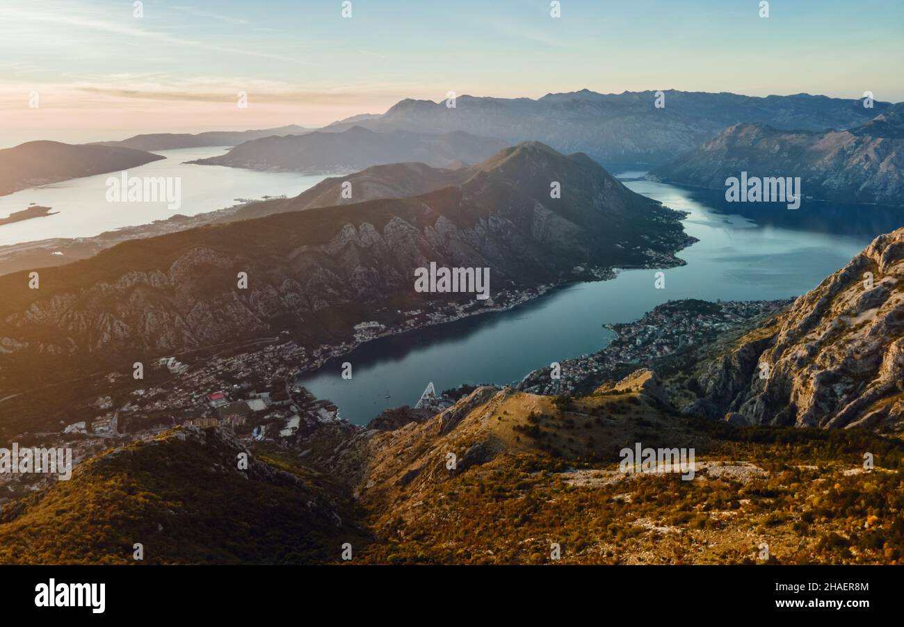 An aerial shot of Kotor and Tivat Bay with rocky mountains and river in ...
