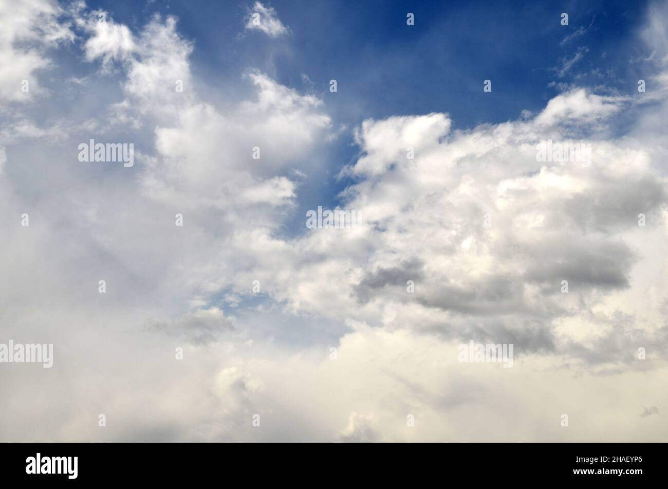 Natural cloudy sky background, white clouds flying in the deep blue sky, summer wallpaper Stock ...