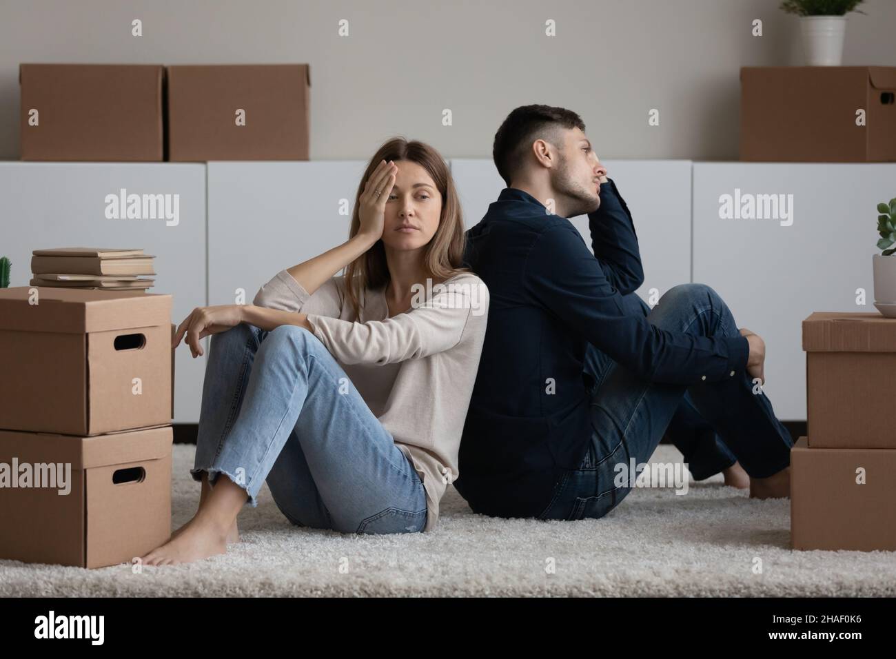 Unhappy young family couple feeling tired of difficult moving day Stock ...