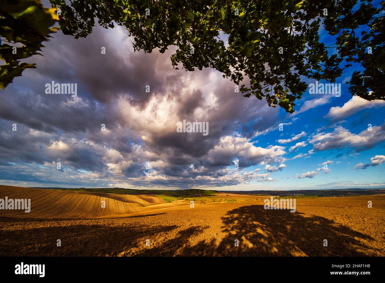 Rolling fields of South Moravia in the autumn morning with a sky full ...